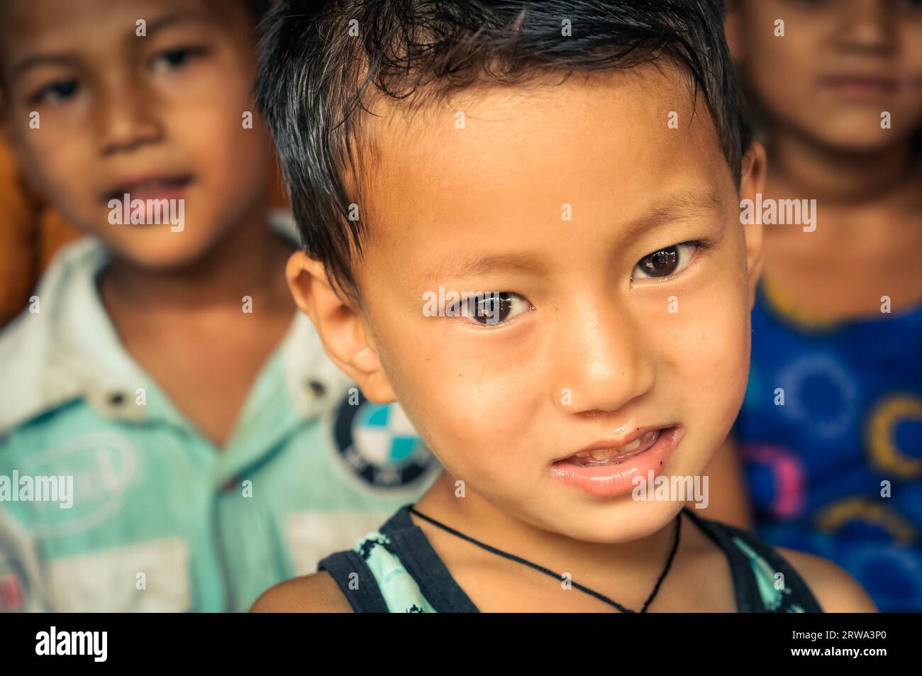 Damak, Nepal, circa May 2012: Photo of young boy with beautiful brown ...