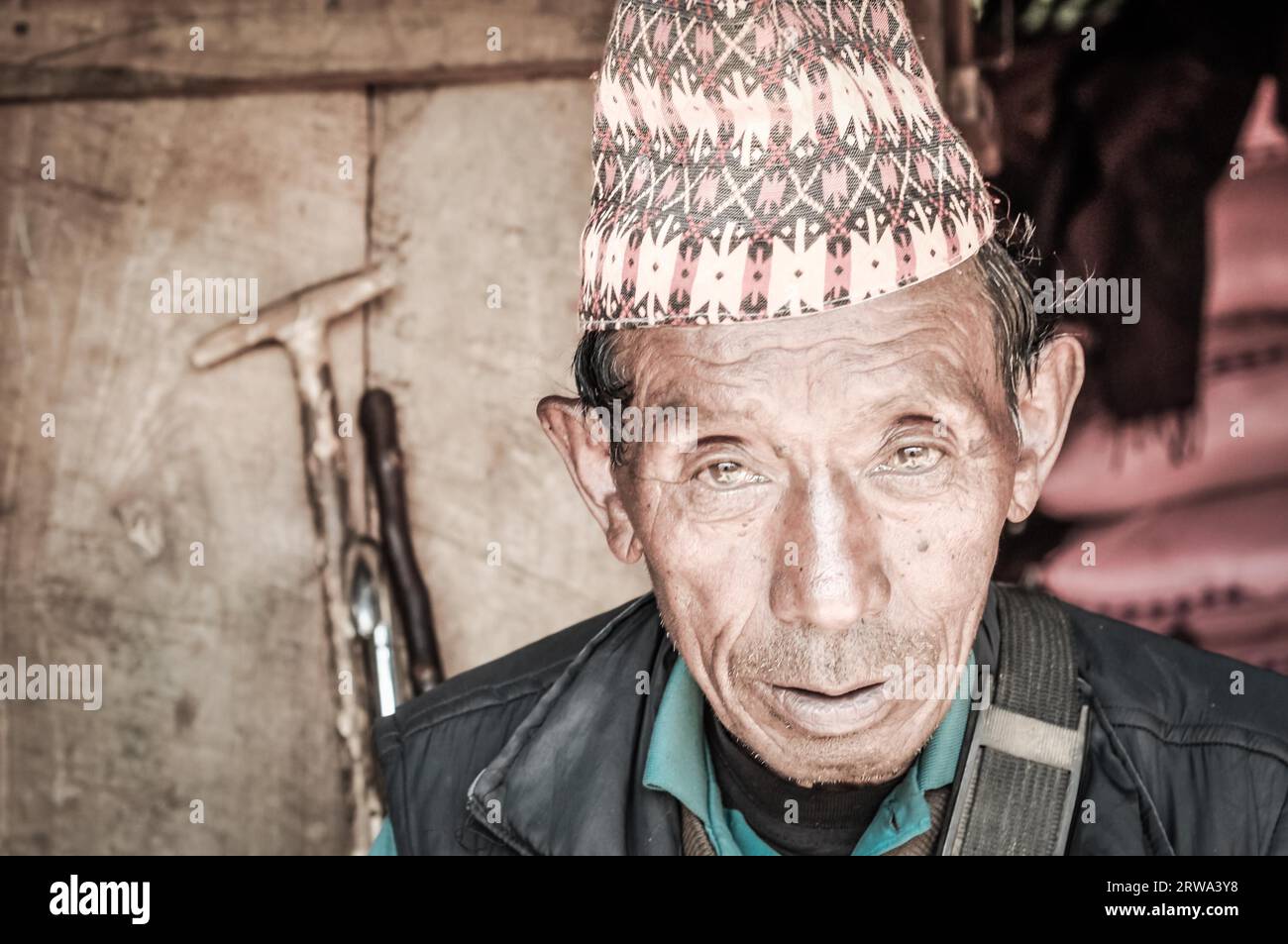 Beni, Nepal, circa May 2012: Old native man with brown eyes and ...