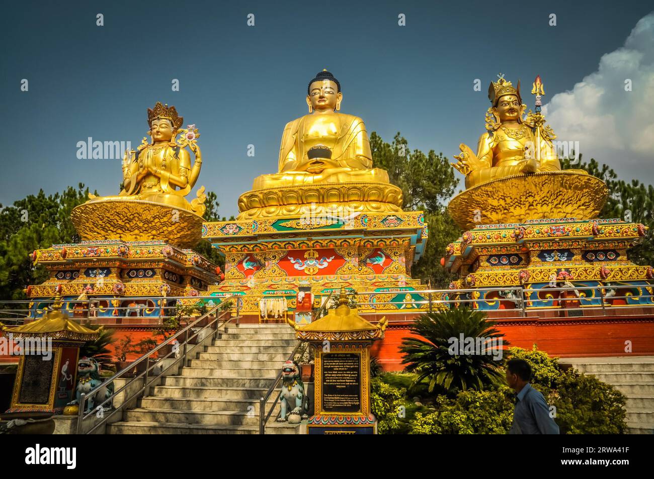Large golden statues of gods with colourful patterns and ornaments in ...