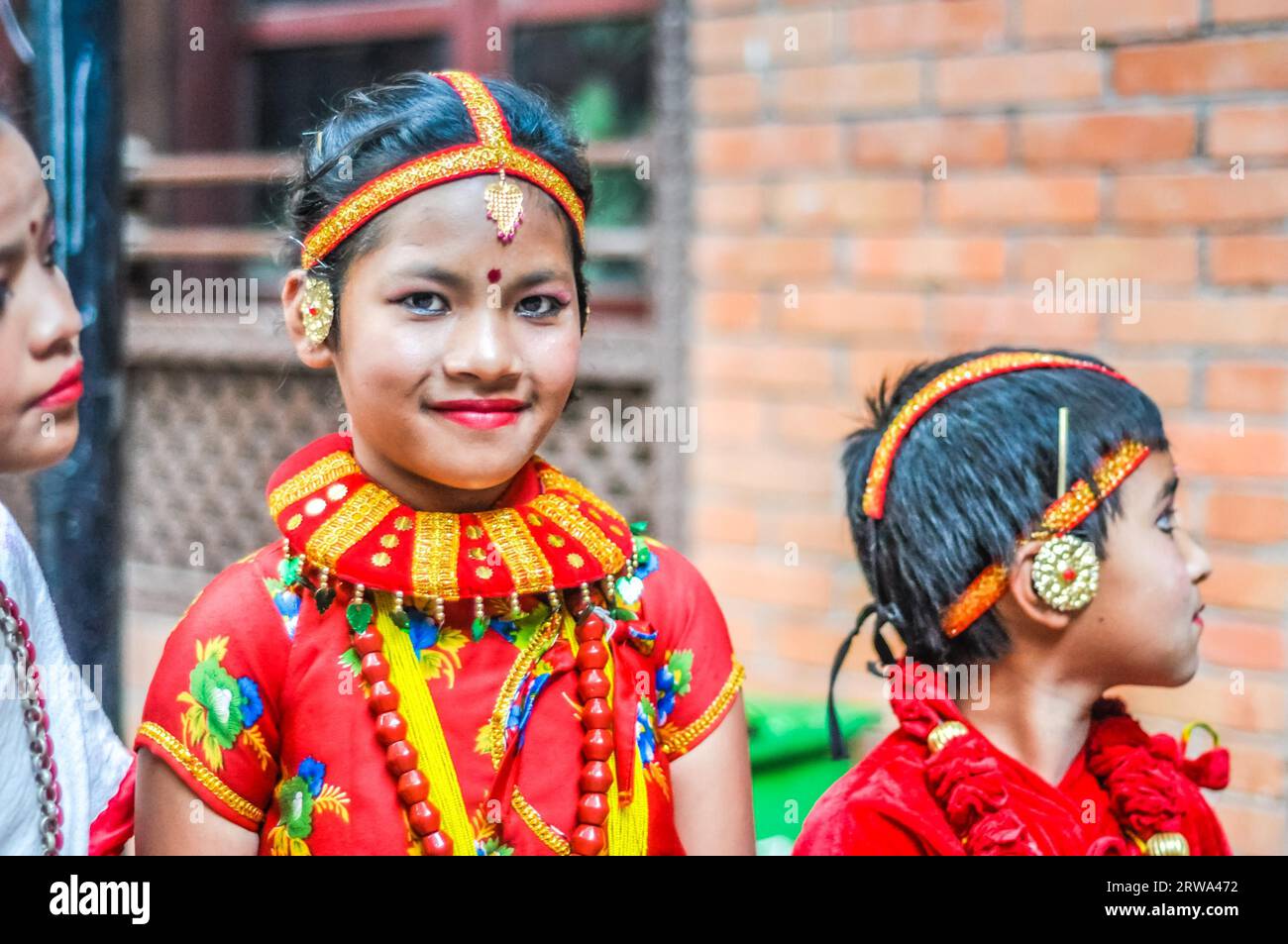 Kathmandu, Nepal, circa May 2012: Native girl in traditional bright ...
