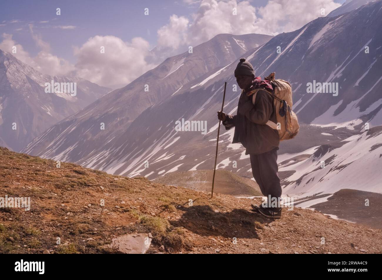 Dolpo, Nepal, circa June 2012: Native man dressed in black clothes with ...