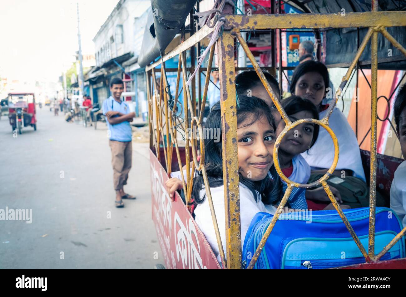 Khulna, Bangladesh, circa July 2012: Young smiling girls sit in ...