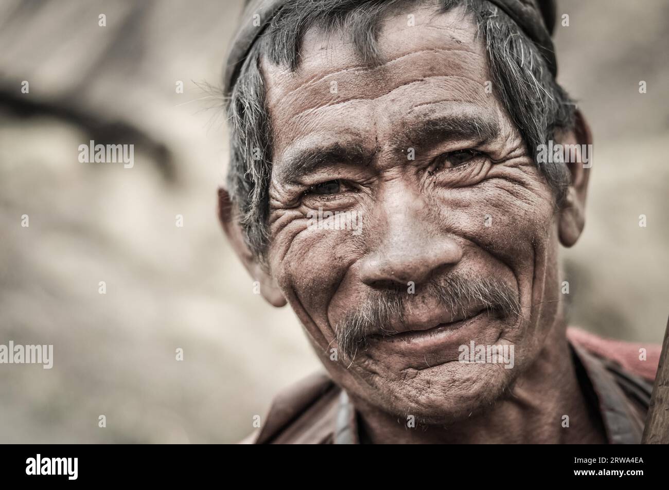 Dolpo, Nepal, circa May 2012: Old wrinkled man with grey hair and ...