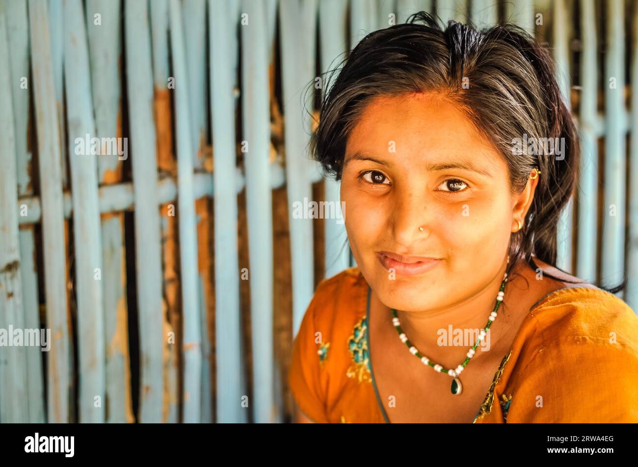 Damak, Nepal, circa May 2012: Young black-haired woman with piercing in ...