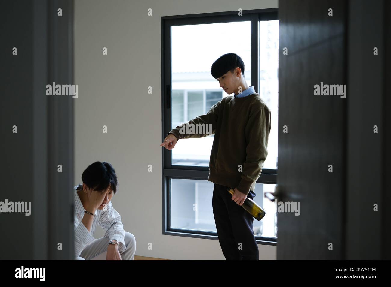 Man alcoholic holding beer bottle scolding stressed upset his boyfriend ...