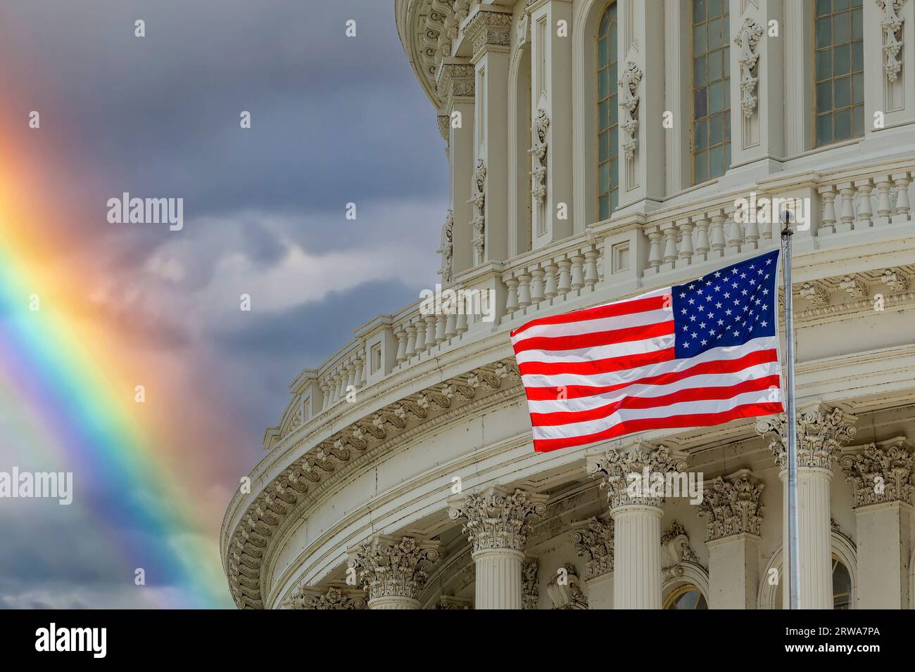 The Washington DC Capitol dome detail with waving american flag and ...