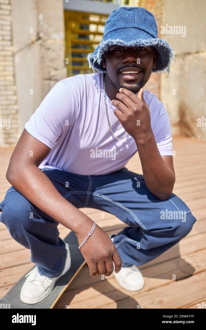 Full length portrait of young Black man wearing streetstyle outfit ...
