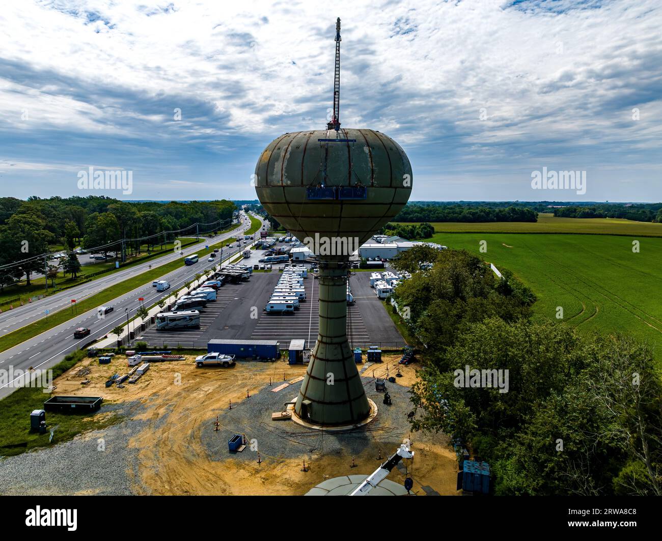 An aerial view of a rusting old water tower on a cloudy day in Smyrna ...