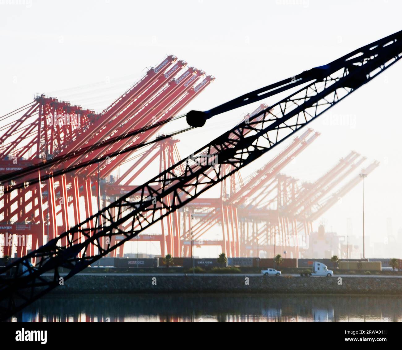 Cargo loading cranes at the waters edge Stock Photo - Alamy
