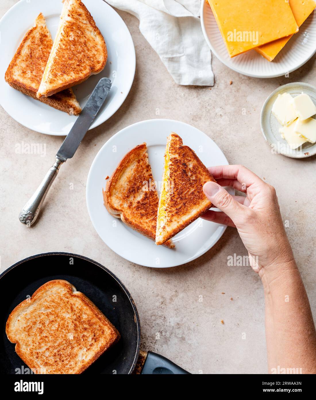 Hand eating sandwich hi-res stock photography and images - Alamy