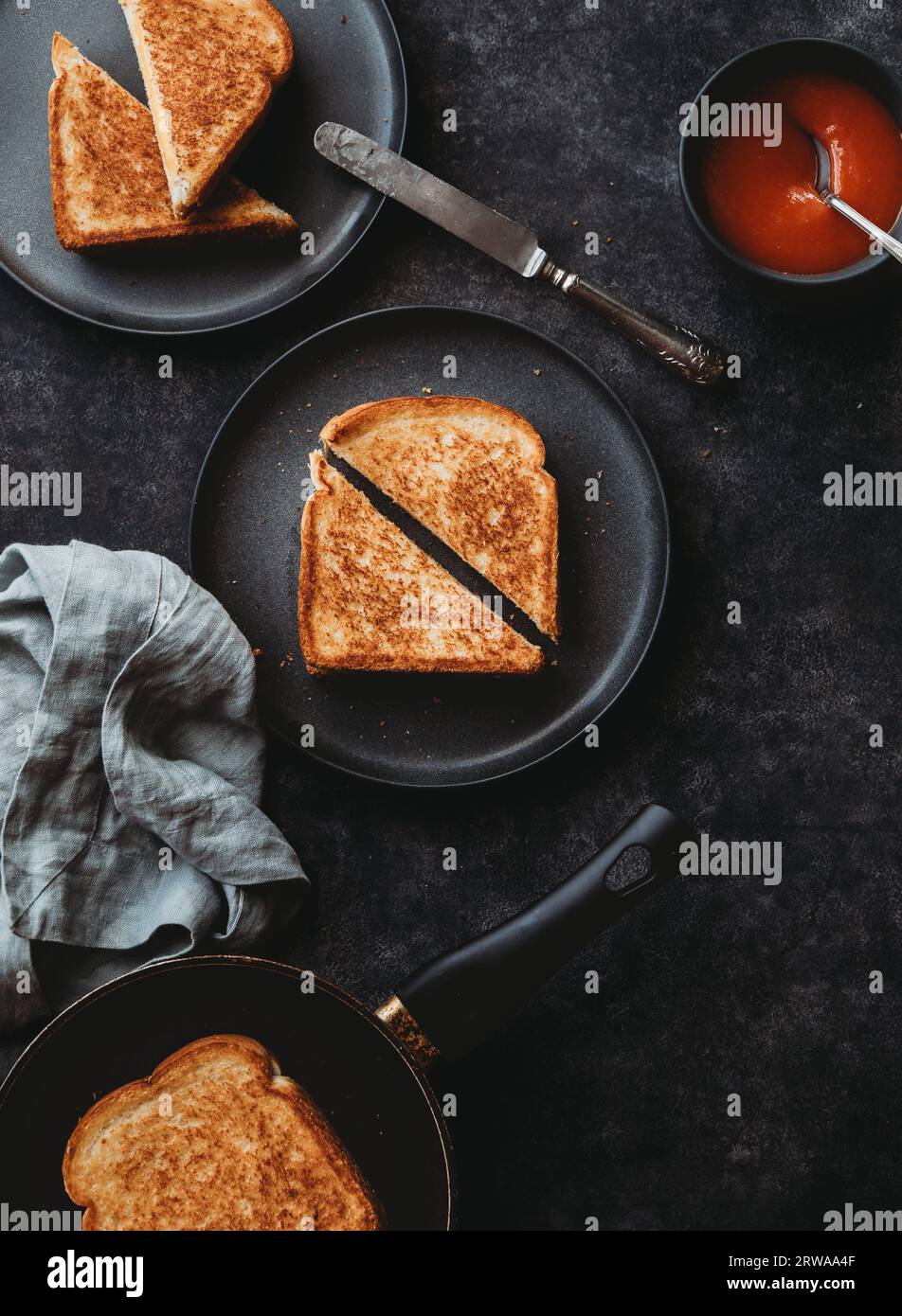 Top view of grilled cheese sandwiches and soup black background Stock ...