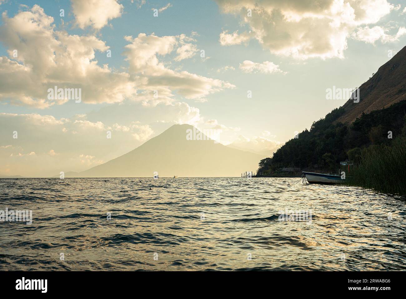 Morning light and Lake Atitlan in Panajachel, Guatemala. Beautiful view ...