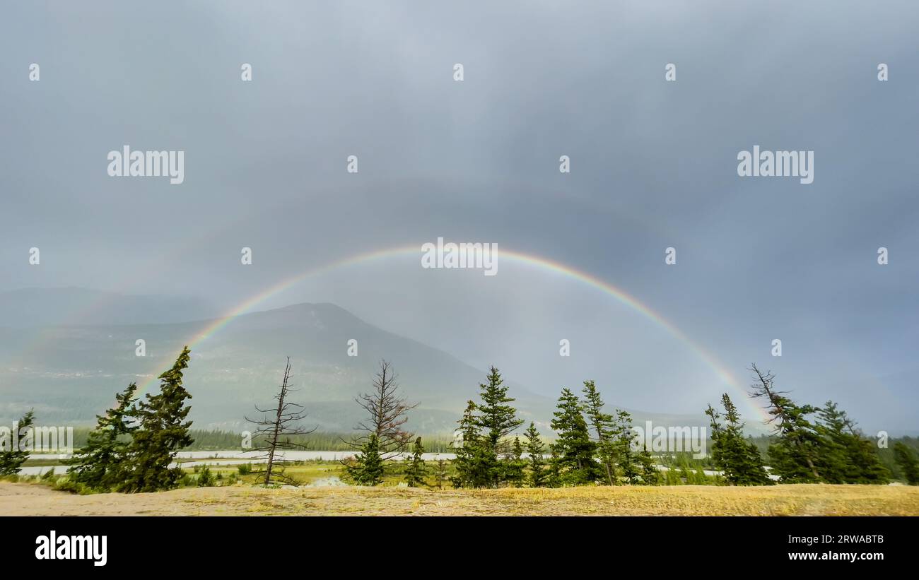 Rainbow over mountain in Jasper National Park in Canada Stock Photo - Alamy