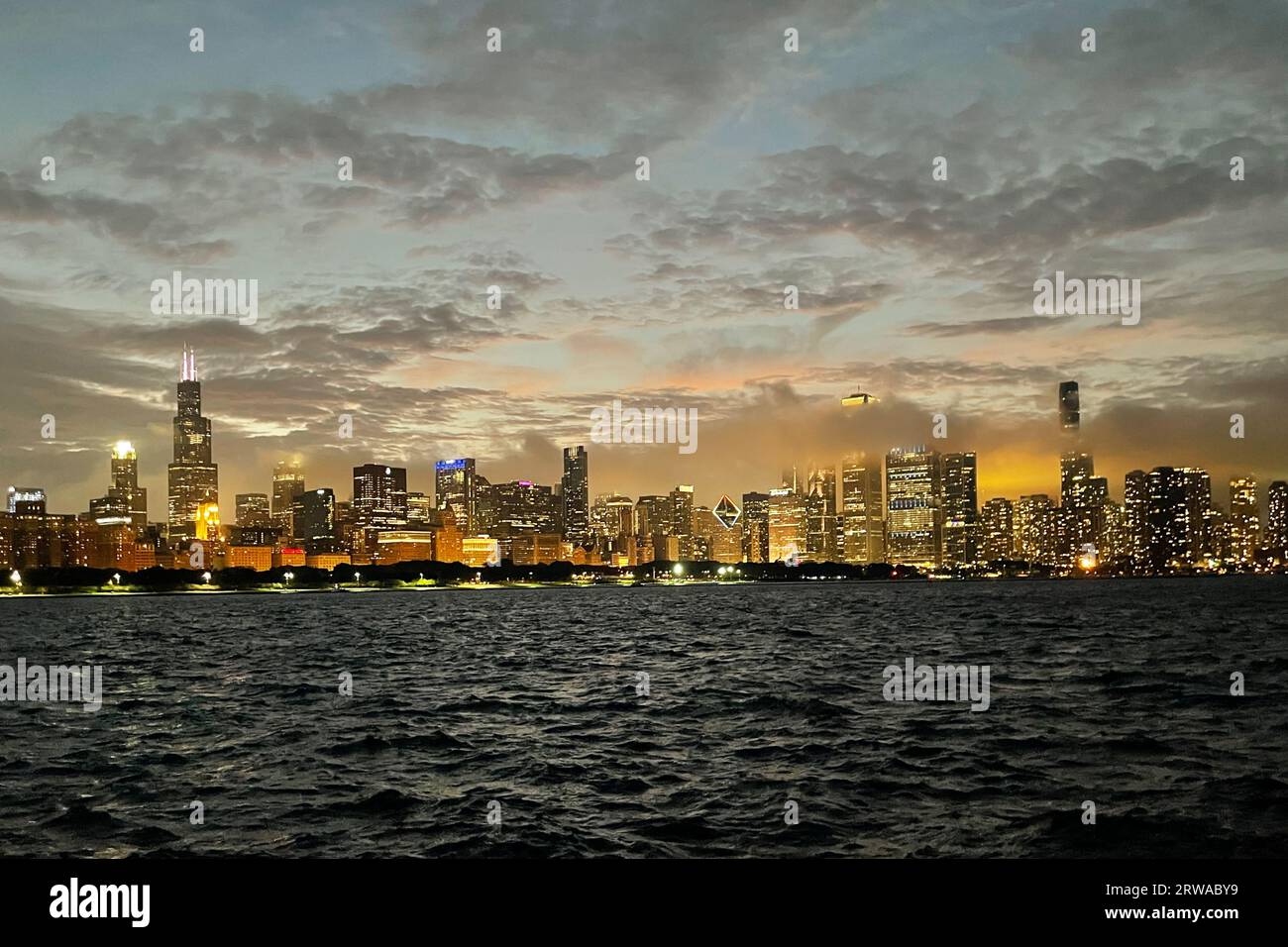 Chicago skyline with dramatic clouds at sunset Stock Photo - Alamy