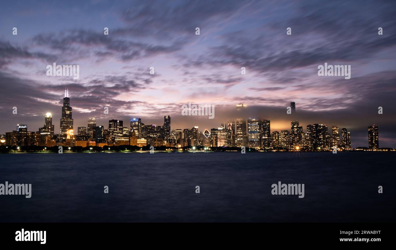 Chicago skyline with dramatic clouds at sunset Stock Photo - Alamy