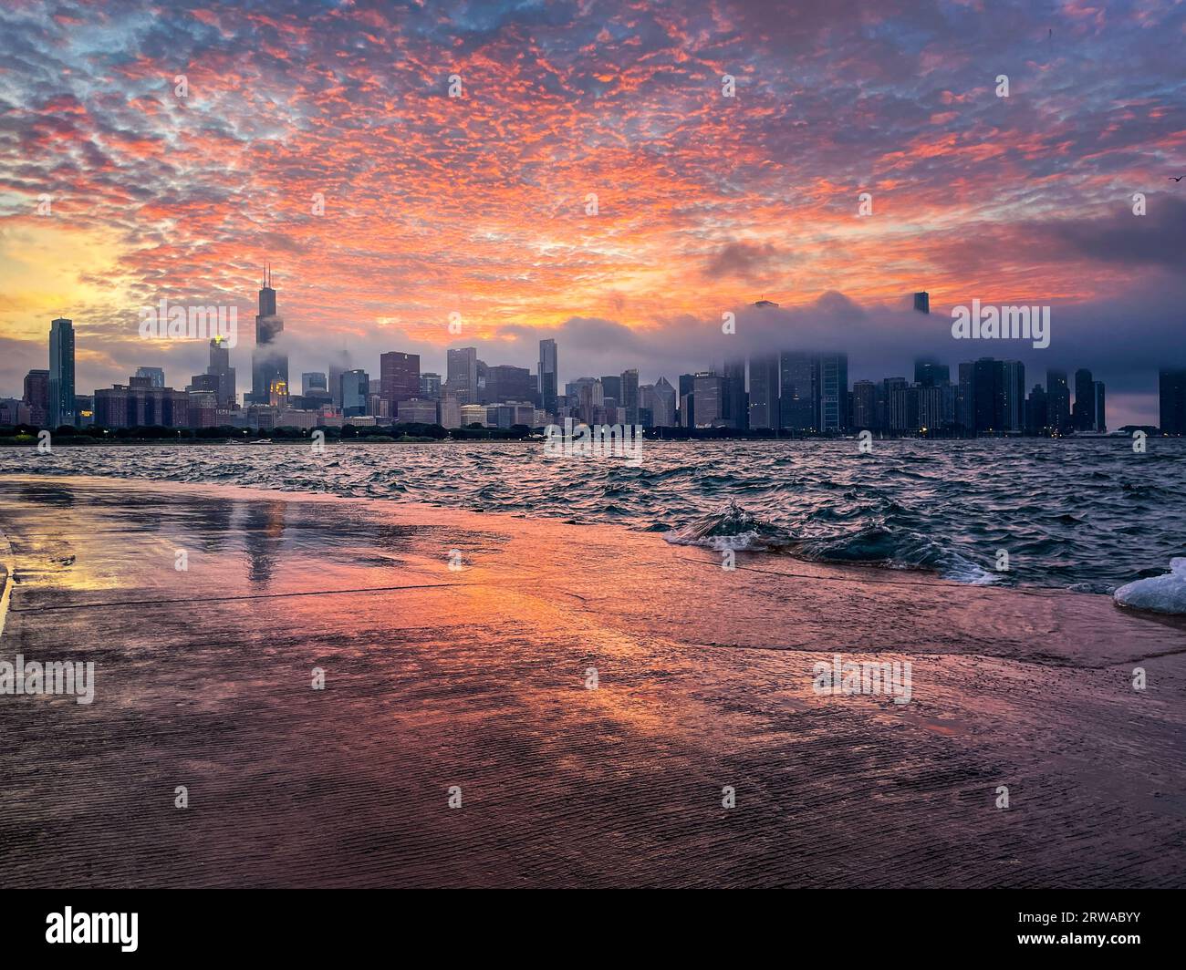 Chicago skyline with dramatic clouds at sunset Stock Photo - Alamy