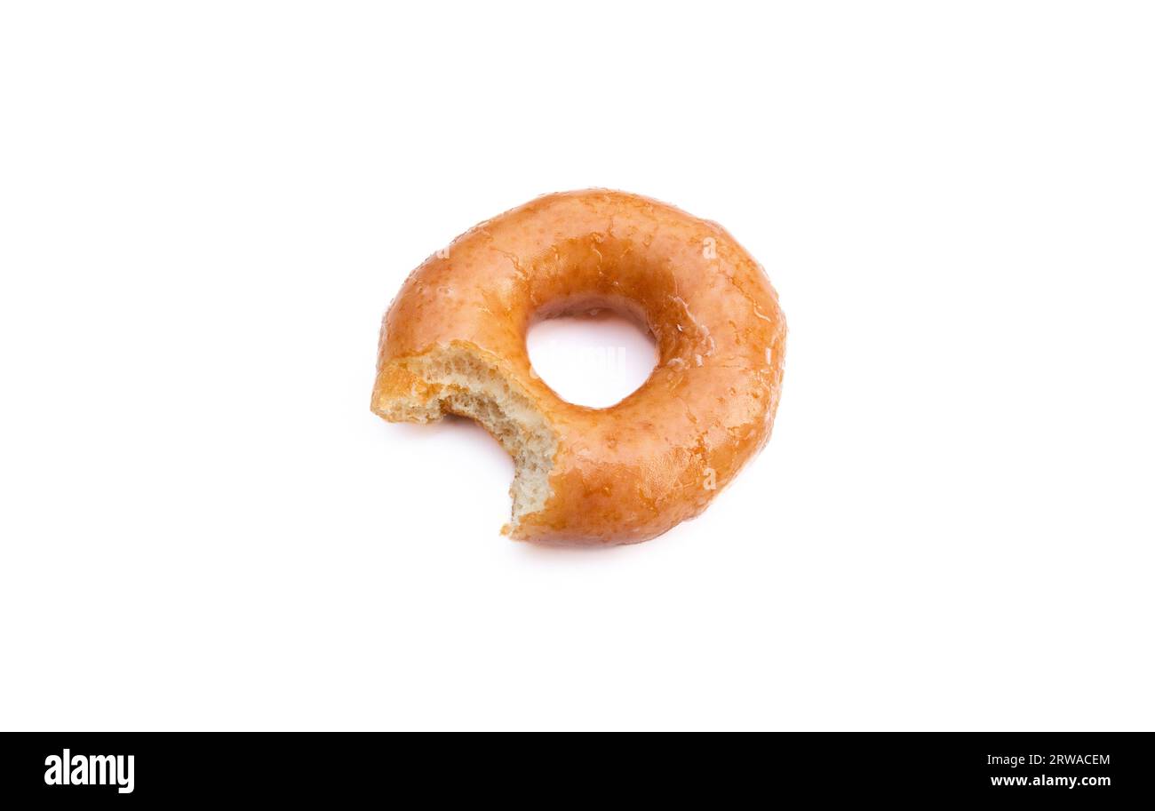 Bitten glazed donut isolated on white background. After some edits ...