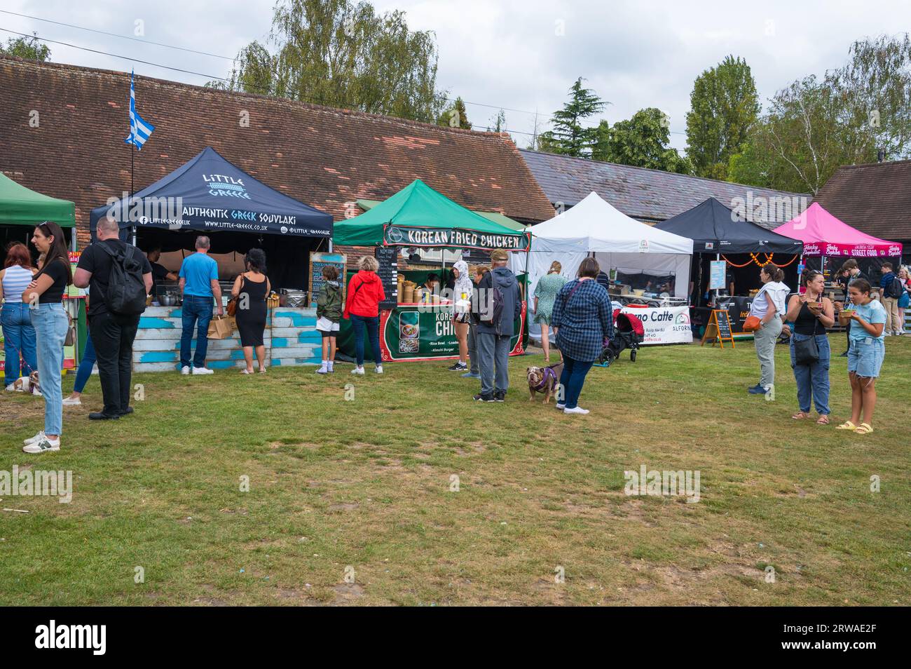People browsing stalls at Duckpond Market, an artisan food and craft ...