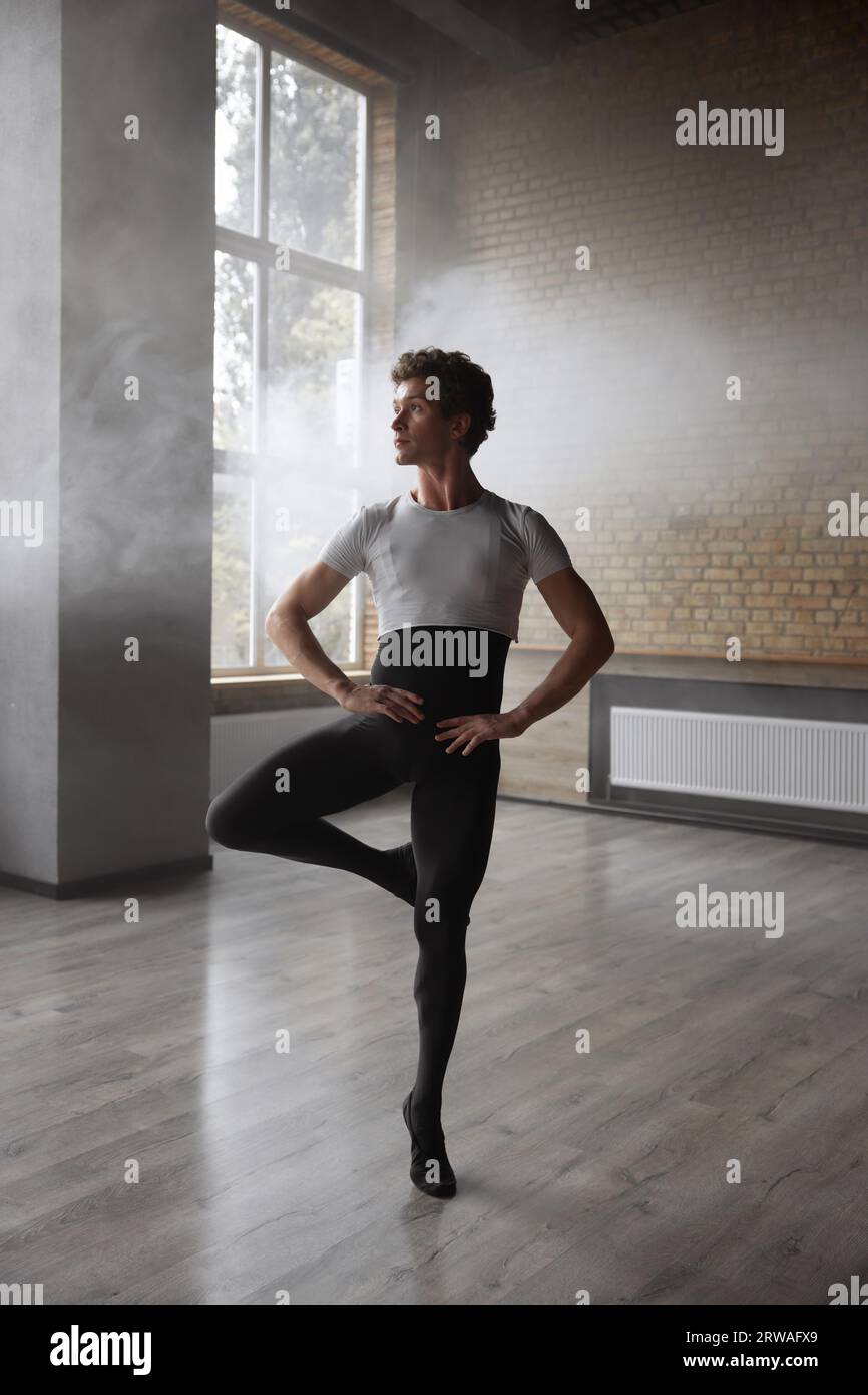 Confidence male ballet dancer practicing alone in studio room Stock ...