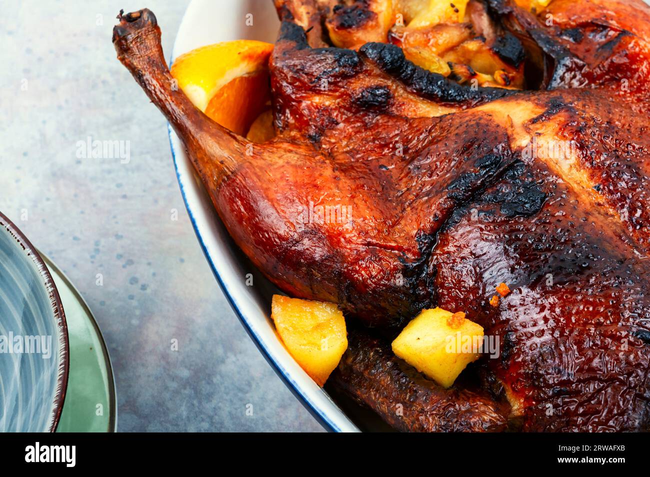 Roast duck with orange and caramelized apples Stock Photo - Alamy