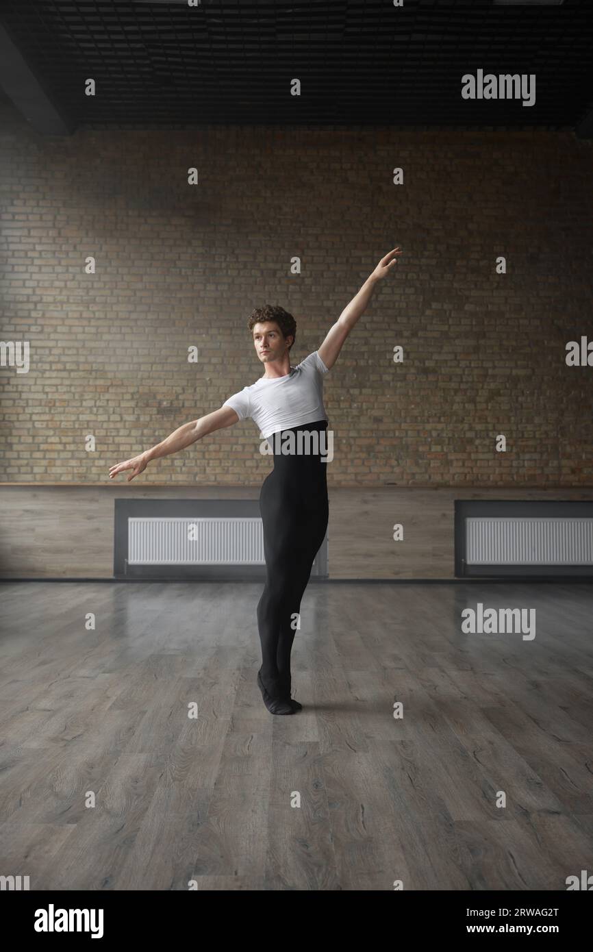 Male dancer practicing in ballet studio holding training class Stock ...
