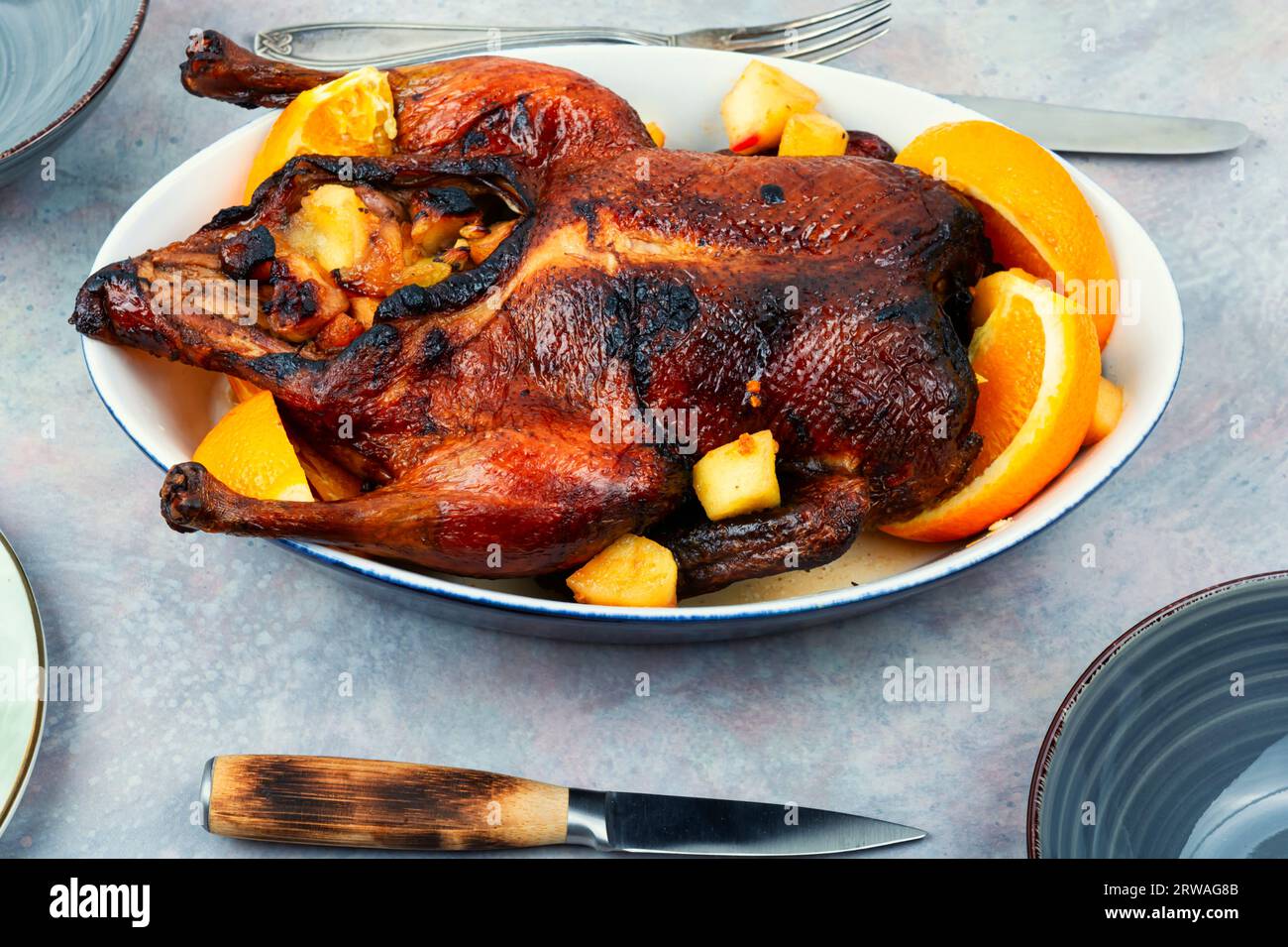 Roast duck with orange and caramelized apples in tray Stock Photo - Alamy