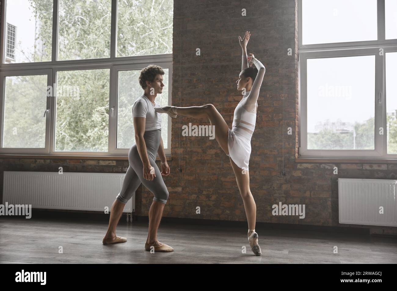 Contemporary ballet dancers couple performing graceful choreography ...