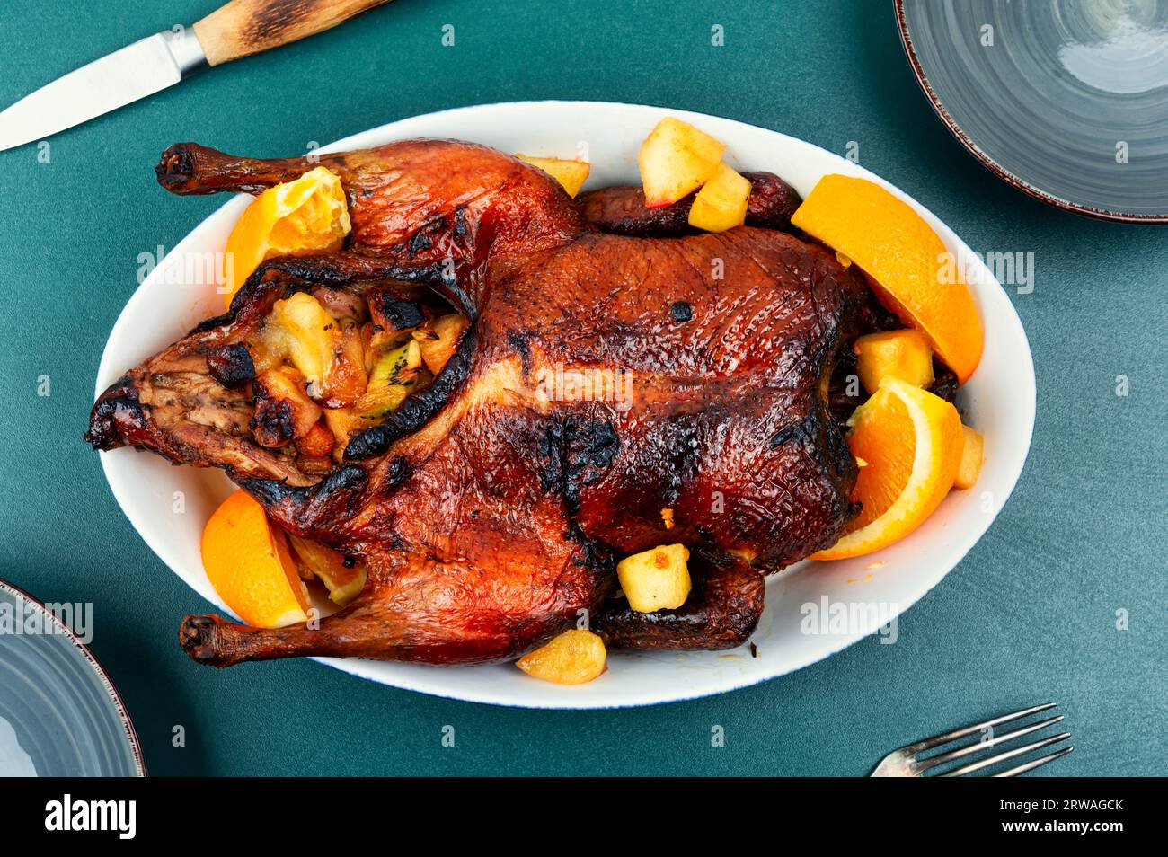 Roast duck with orange and caramelized apples Stock Photo - Alamy