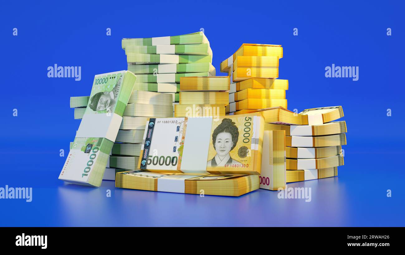 Stacks of South Korean won notes. A lot of money isolated on blue ...
