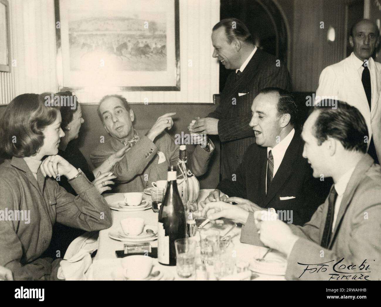 LAUREN BACALL HUMPHREY BOGART and WARREN STEVENS candid at restaurant ...
