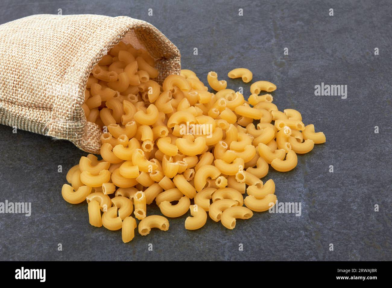 Bowl uncooked elbow pasta hi-res stock photography and images - Alamy