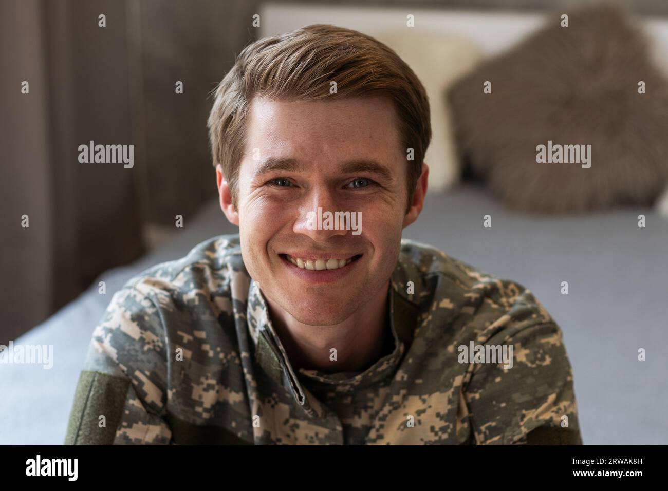 Portrait of a smiling male soldier Stock Photo - Alamy