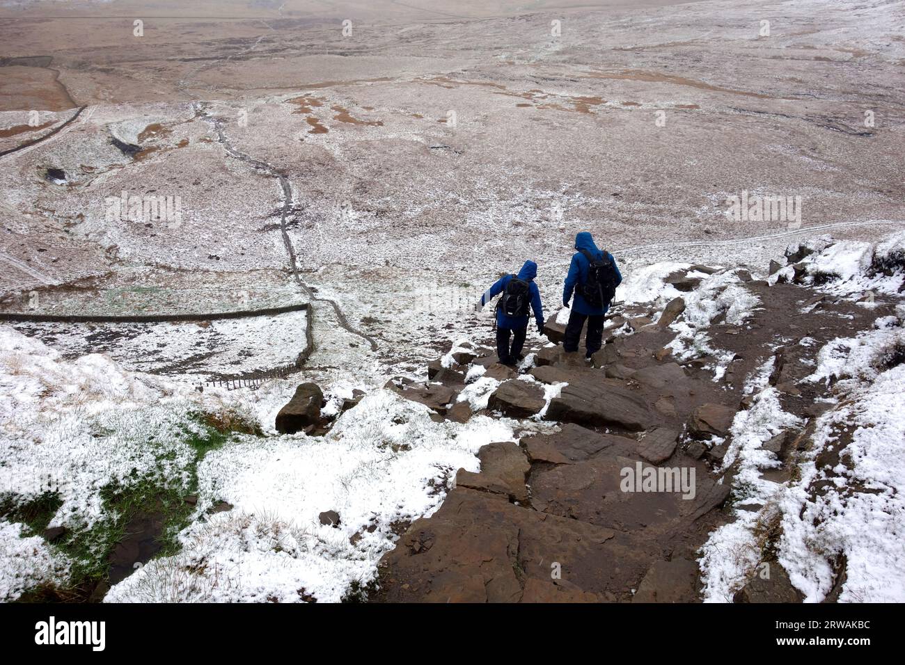 Two Men Walking on Steep Stone Path in Snow from Ingleborough one of ...