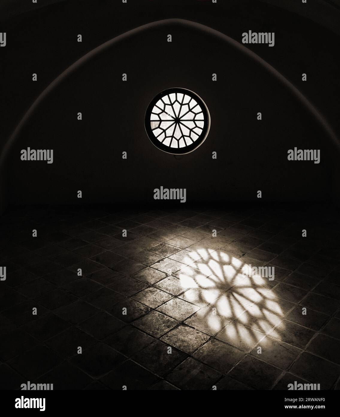 Sunlight and shadow through a round window, Iran Stock Photo - Alamy
