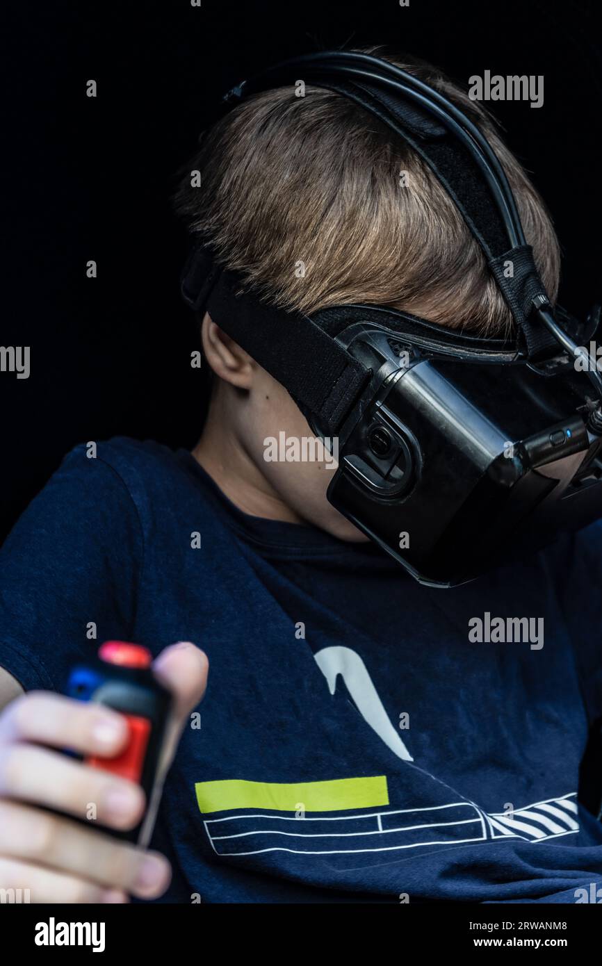 Boy playing a virtual reality video game Stock Photo - Alamy