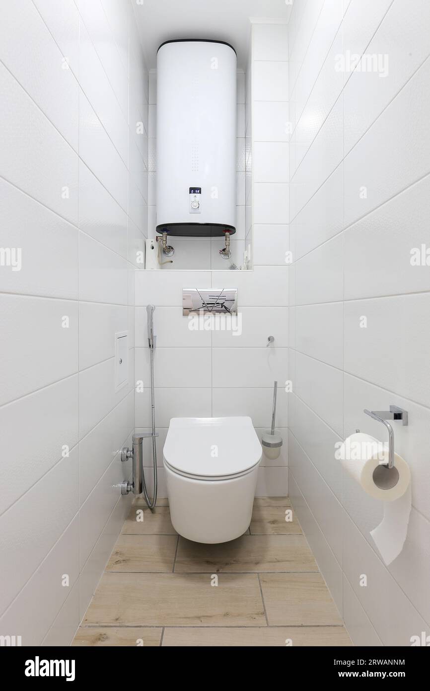 White toilet bowl with electric boiler in a bathroom interior Stock ...