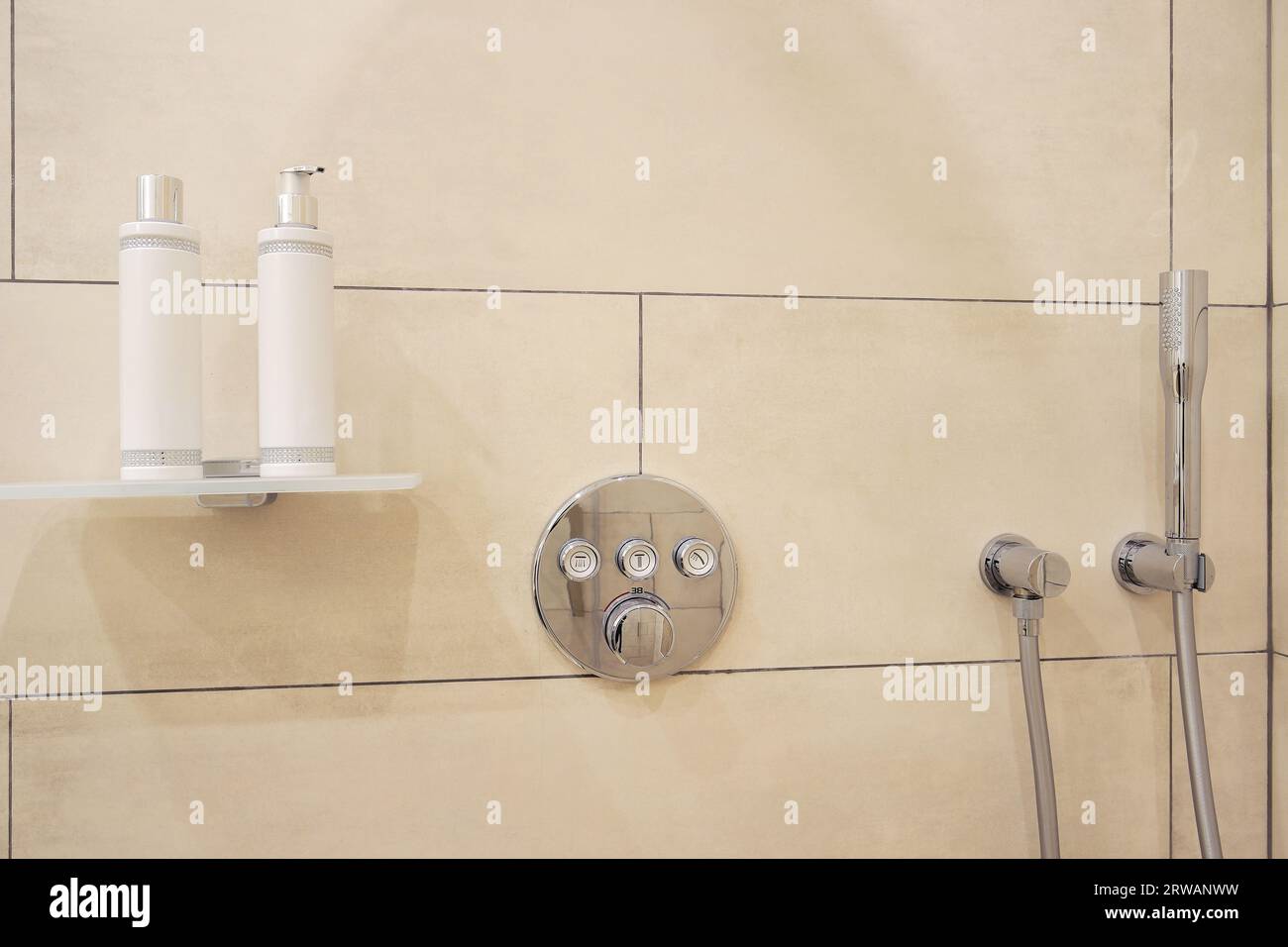Chrome plumbing close-up in the shower room interior Stock Photo - Alamy