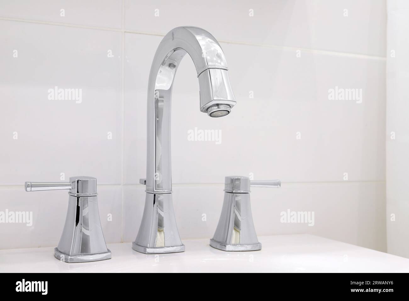 Chrome faucet close-up in the bathroom interior Stock Photo - Alamy