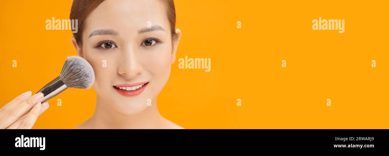 Banner of Beautiful girl doing contouring apply blush on cheeks Stock ...