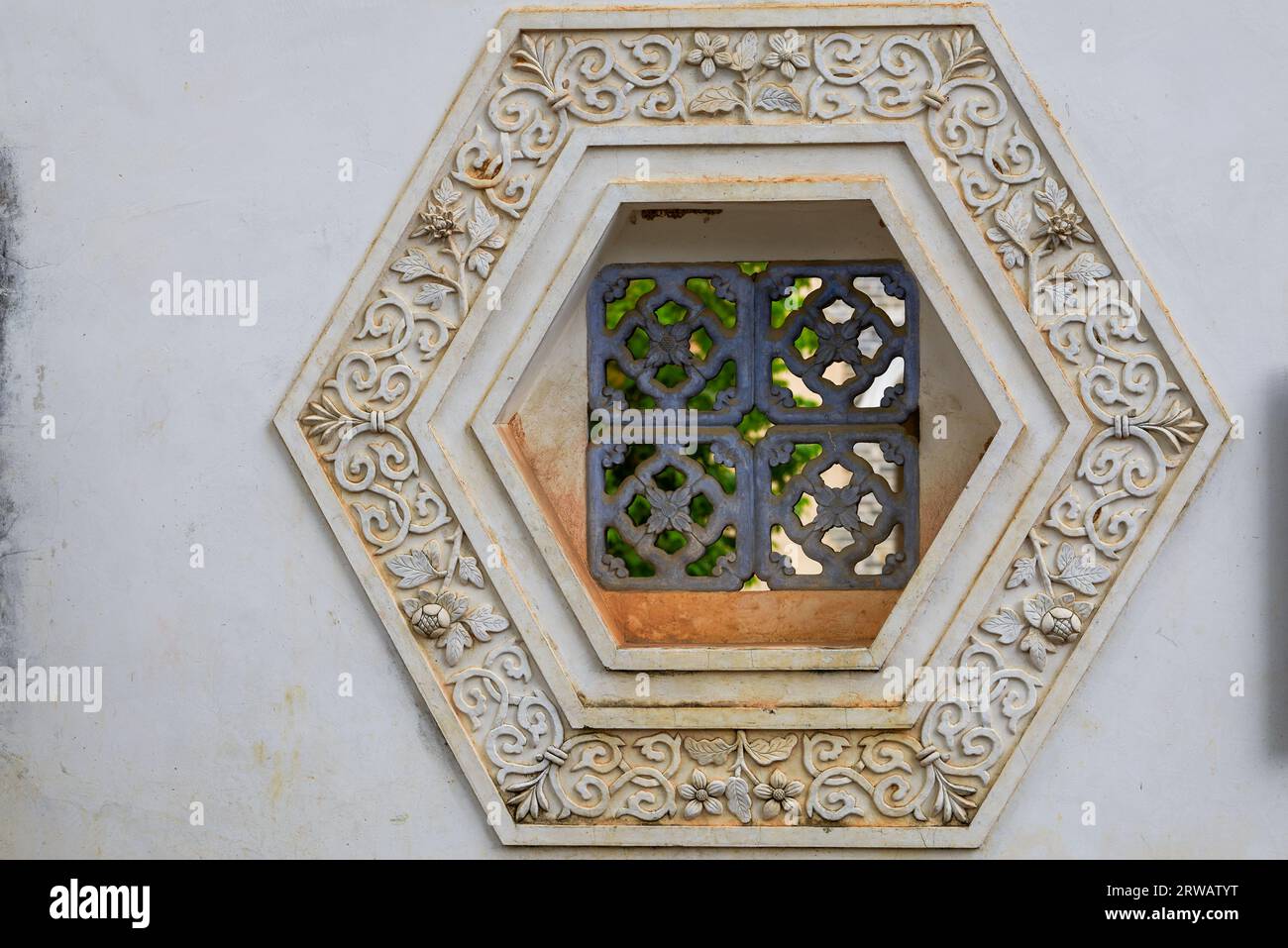 Close-up of traditional transom on the wall of ancient building during ...