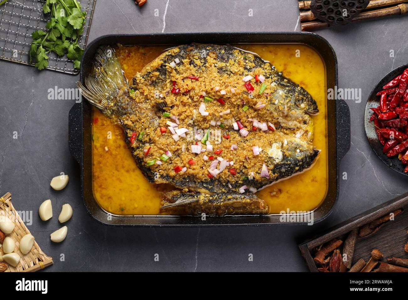 chong qing House Roast Fish with Mashed Garlic Stock Photo - Alamy