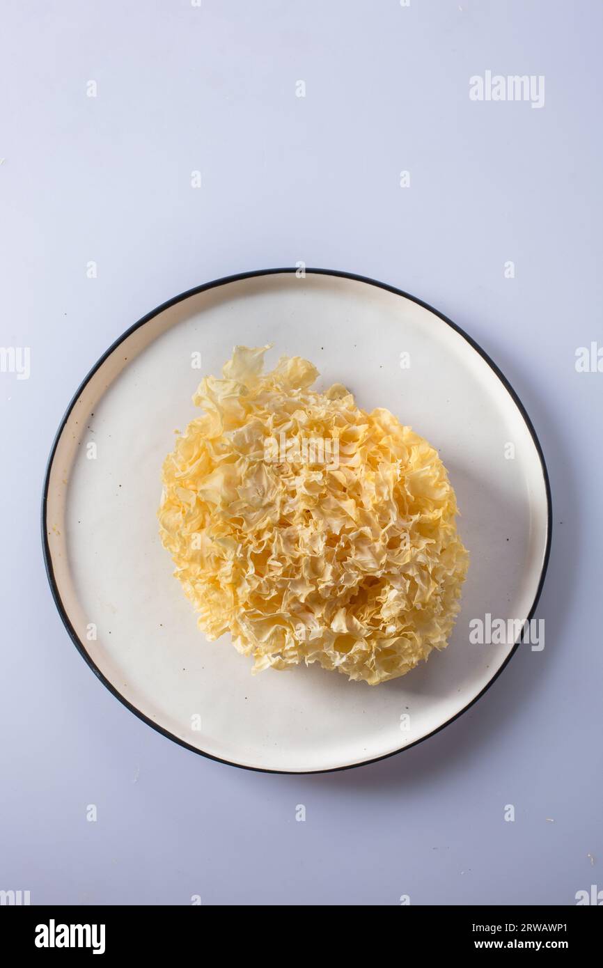 Fresh white fungus (Tremella fuciformis) on a bamboo background Stock ...