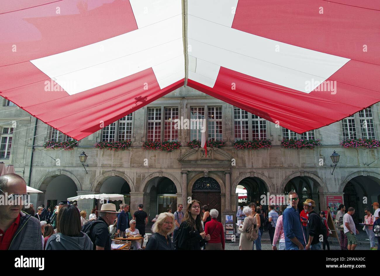 LAUSANNE, SWITZERLAND - AUGUST 5, 2023: People under the Swiss flag in ...