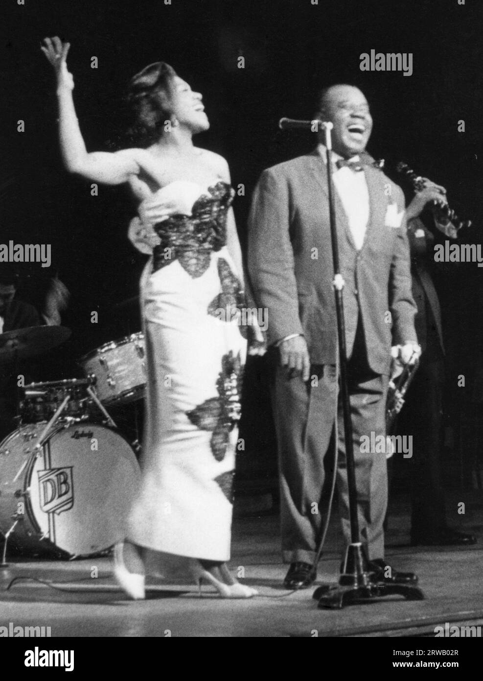 Jazzman Louis Armstrong joins his new singer, Jewel Brown, in a number ...