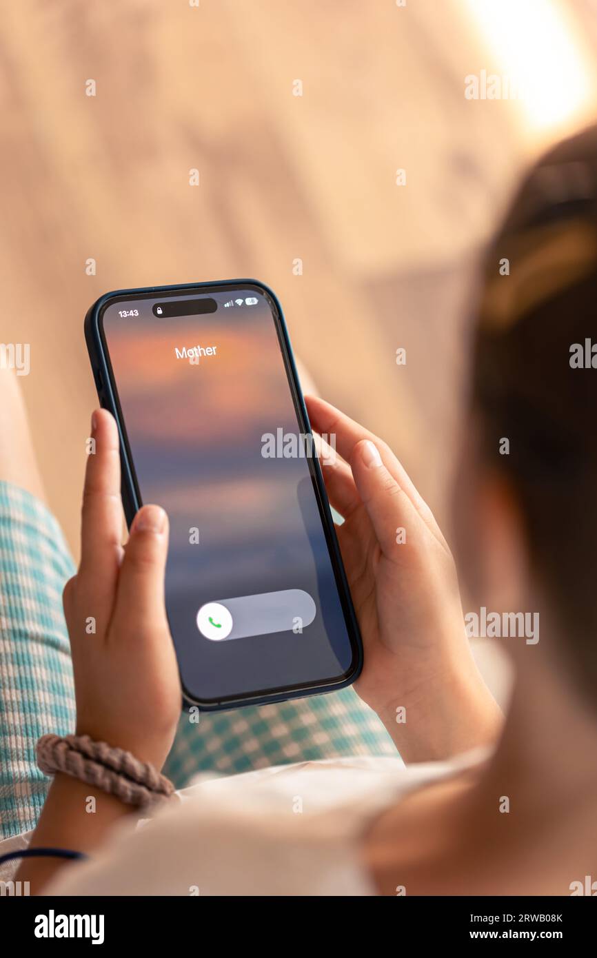 Smartphone in child hands with Incoming mother call on a screen Stock ...