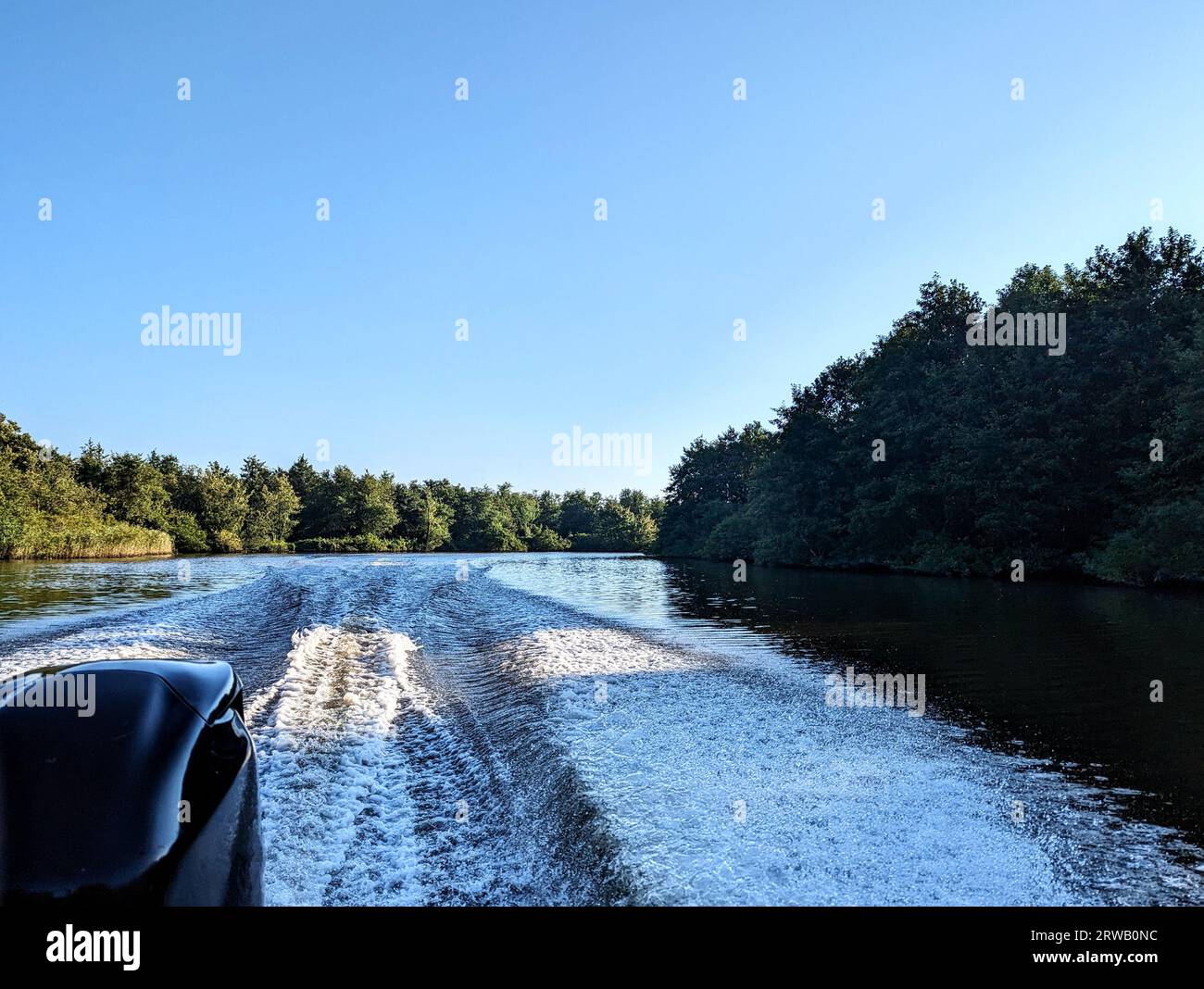 path on the water behind the stern of the boat from the engine Stock ...
