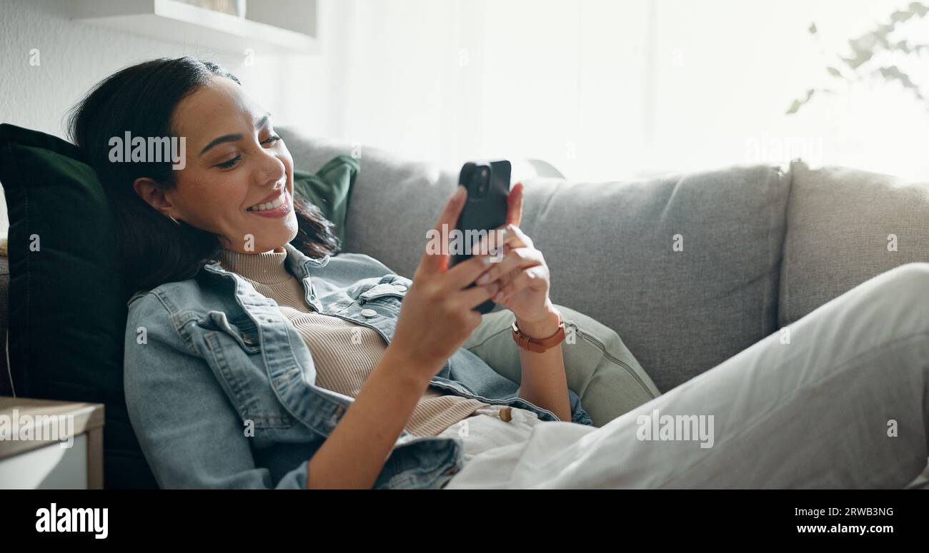 Woman, phone texting and home with social media post, networking and ...