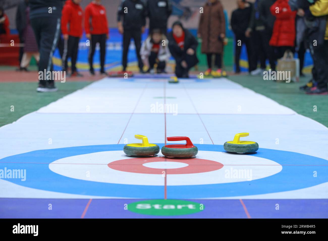 The indoor land curling competition was held at a staff meeting Stock ...