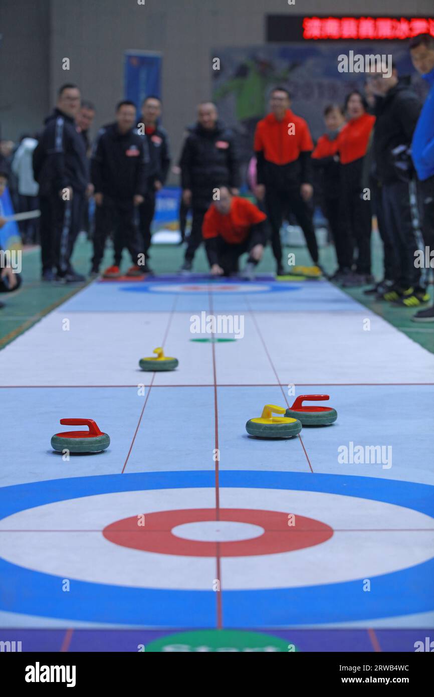 The indoor land curling competition was held at a staff meeting Stock ...