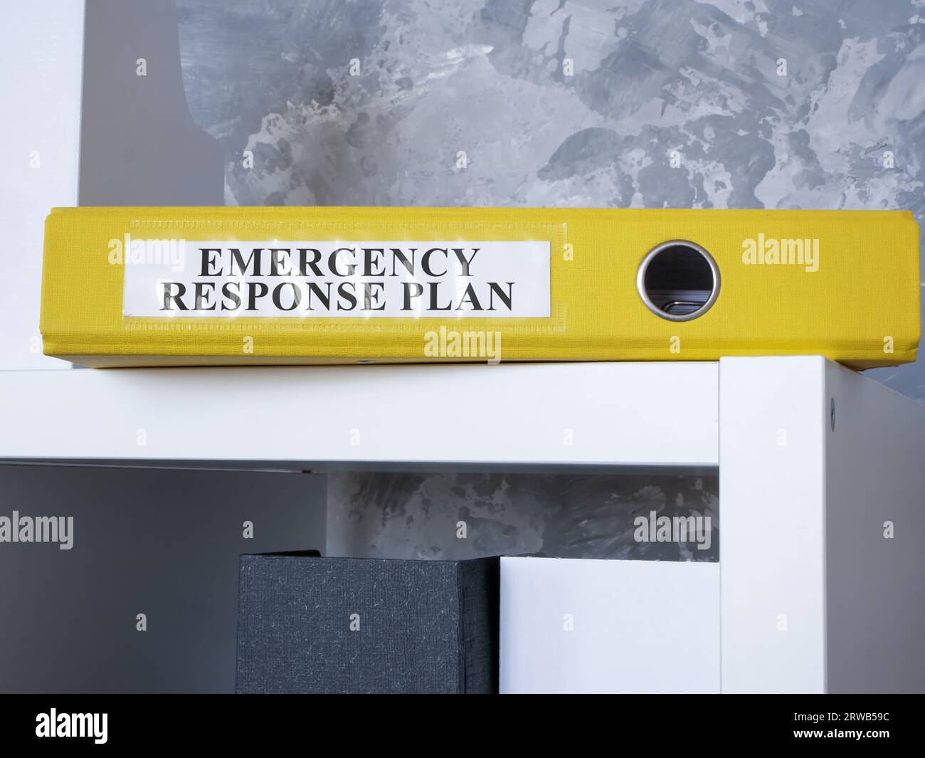 A folder with emergency response plan lies on an office shelf Stock ...